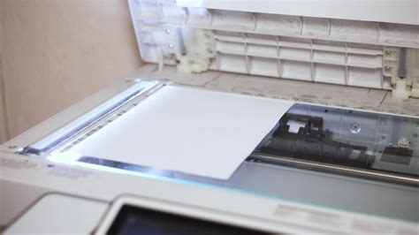 An Office Scanner Performs The Process Of Scanning An A Document Stock Video At Vecteezy