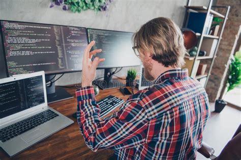 Photo Of Young Stressed Programmer Man Blond Hair Wearing Eyeglasses And Checkered Shirt Sitting