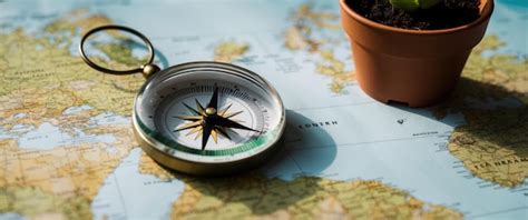 A Compass On A Map Symbolizing Navigation And Adventure In Exploration