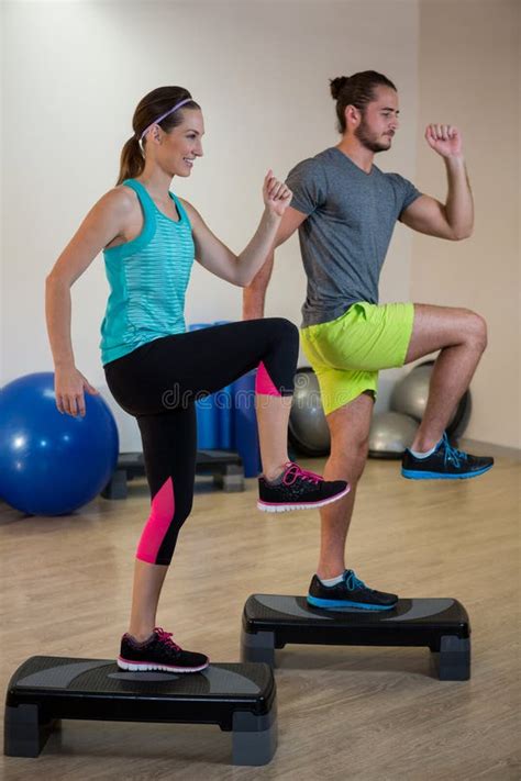 Man And Woman Doing Step Aerobic Exercise On Stepper Stock Image Image Of Exercise Health