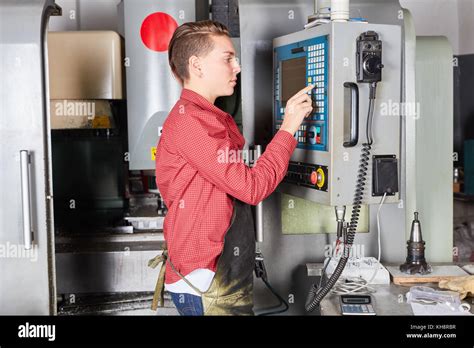 Woman As Machinist Programs CNC Machine In Metallurgy Workshop Stock Photo Alamy