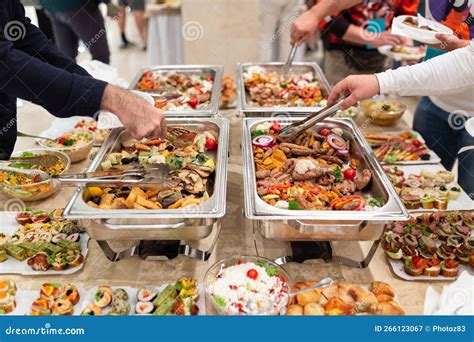 hands picking up food from buffet catering table at the party stock image image of fresh