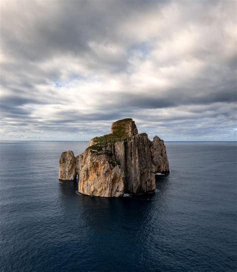 View Of The Pan Di Zucchero Sea Stack In Porto Flavia On Sardinia Stock
