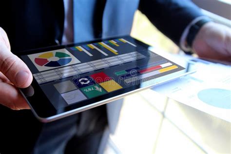 Businessman Analysis Graphs On The Tablet Virtual Chart Shows Grouth