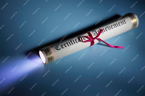 Premium Photo Roll Of Diploma Certificate Like A Torch Light