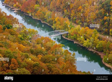 An Aerial View Of A Colorful Autumn Landscape With A Bridge In New