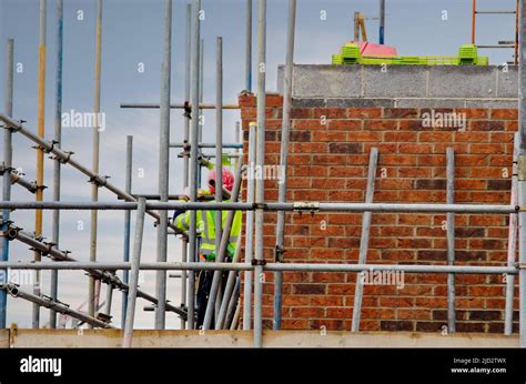 Scaffolder Erection Scaffolds During New Residential House Construction Stock Photo Alamy