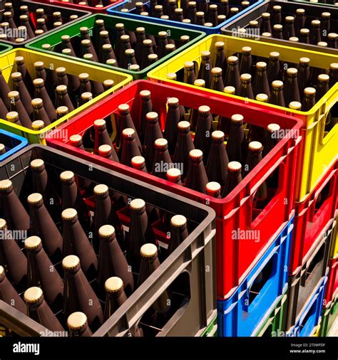 Countless Colorful Beer Crates Full Of Bottles Stacked In An Outdoor