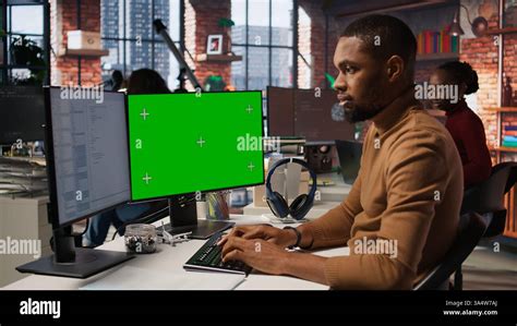 Programmer Coding In Startup Office Using Green Screen Pc Building