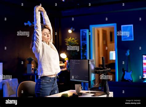 Computer Scientist Doing Software Quality Assurance Stretching After Reading Source Code