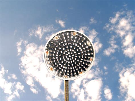 Showerhead Reflecting Light Against Blue Sky Free Stock Photo Freeimages