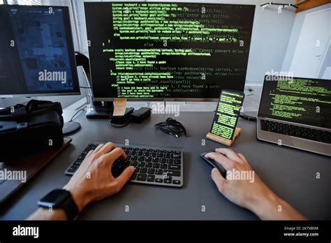 Pov Shot Of Computer Programmer Working With Green Code Lines On