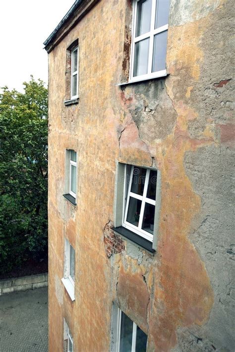 Angle Buildimg Wall In Bad Condition With New Plastic Windows Side View