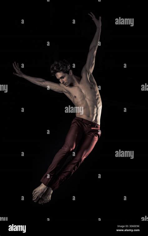 Color Portrait Of A Male Ballet Dancer Performing An Elegant Classical