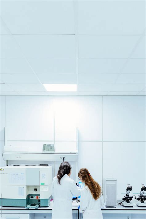Two Young Biologists In Laboratory By Stocksy Contributor Victor Torres Stocksy