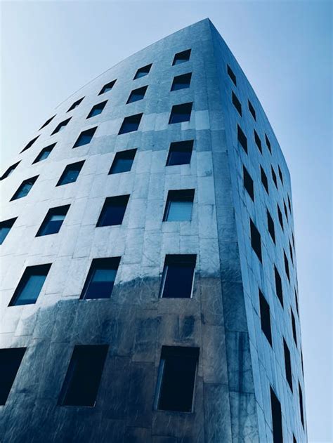 푸른색 외관의 현대 건축 건물 · 무료 스톡 사진