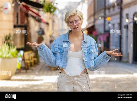 Doubtful Sad Frustrated Young Blonde Woman Shrugging Shoulders Dont Know Answer Incertitude
