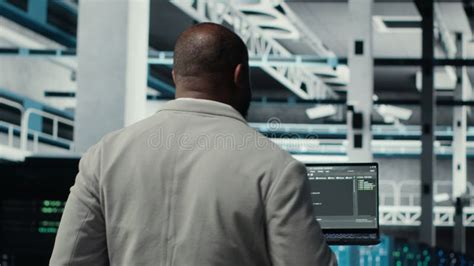 Programmers Walking In Data Center Coding Doing Optimizations Using