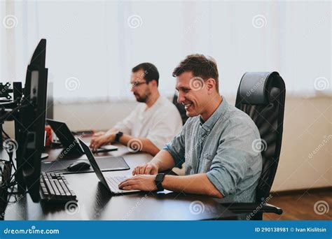portrait of two professional male programmers working on computer in diverse offices modern it