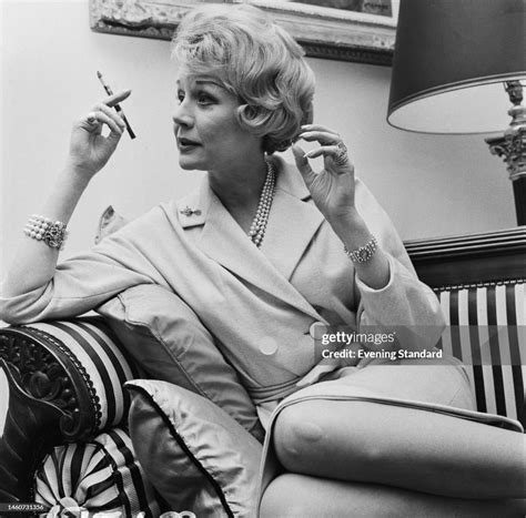 British Actress Margaret Leighton Sitting On A Sofa And Smoking On