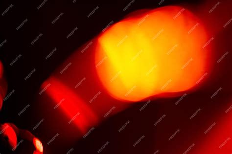 Premium Photo | Bokeh light blur radiance glowing flecks defocused bright neon red orange ...