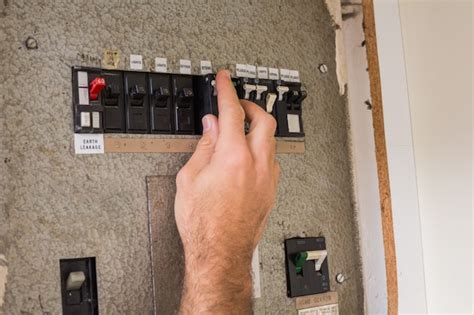 Premium Photo Electrician Working On The Fuse Box