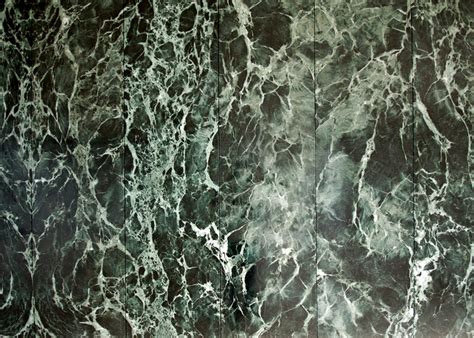 Monolithic Marble Partition Divides Antwerp Penthouse