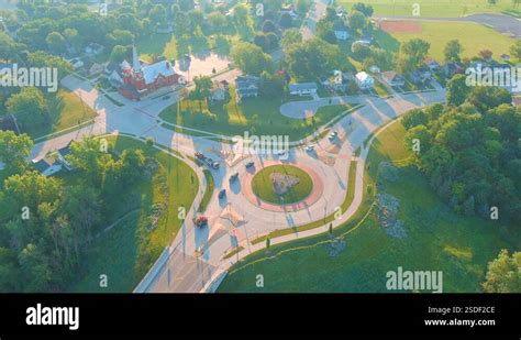 Misty Morning Aerial View Of Busy Roundabout Intersection In Small Town America Stock Video