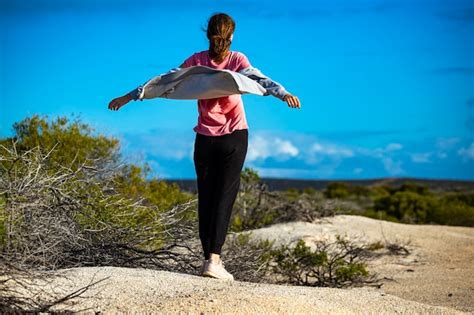 Premium Photo A Beautiful Girl Spreads Her Arms Wide While Savouring