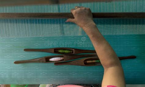Woman Working On Weaving Machine For Weave Handmade Fabric Textile