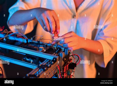 Teen Doing Experiments In Robotics In A Laboratory Close View Of A Girl Working With A Robot