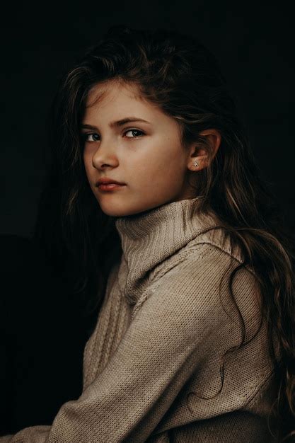 Premium Photo Close Up Portrait Of Cute Girl Against Black Background