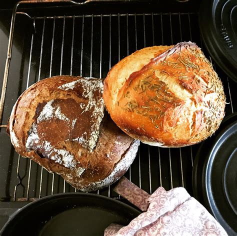 Two Loaves Of Bread Sitting On Top Of A Grill