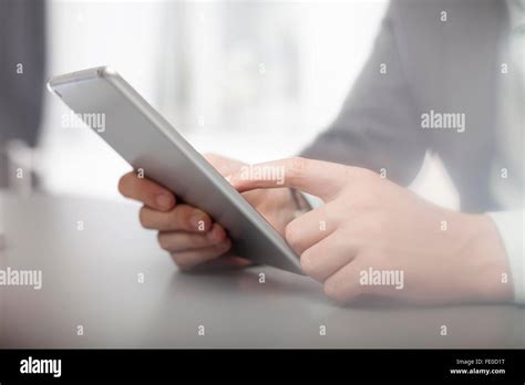 Man Navigating The Internet With His Finger On The Touch Screen Of His