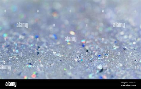 Liquid glitter spill. Shiny gel texture. Defocused holographic sequin ...