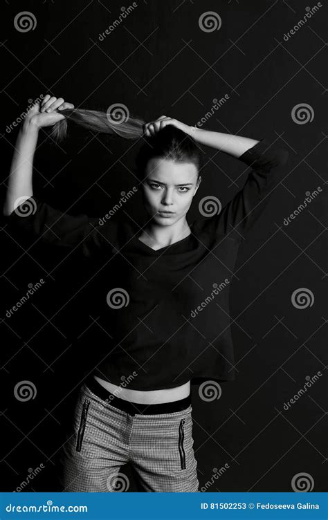 Skinny Tall Girl Of Model Appearance Touching Hair Stock Image