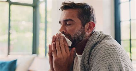 Sickness Blowing Nose And Tired With Man On Sofa For Fatigue Virus
