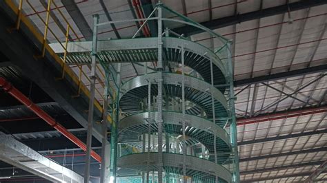 Gravity Spiral Conveyor Handling Totes In Ecommerce Fulfillment Center