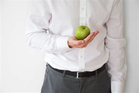 Premium Photo Businessman In Shirt And Suit Holding A Green Apple