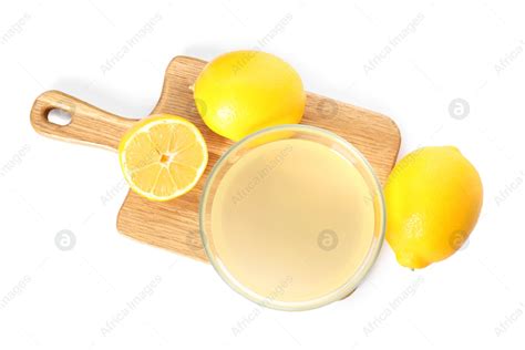 Freshly squeezed juice and lemons on white background, top view: Stock Photo | Download on ...