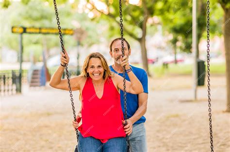 Premium Photo Married Mature S Couple Enjoy Happy In Playground Swing