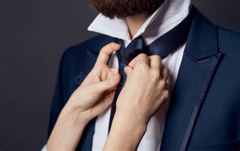 Womens Hands Tie Around The Neck Of Men Classic Suit Model Beard Stock
