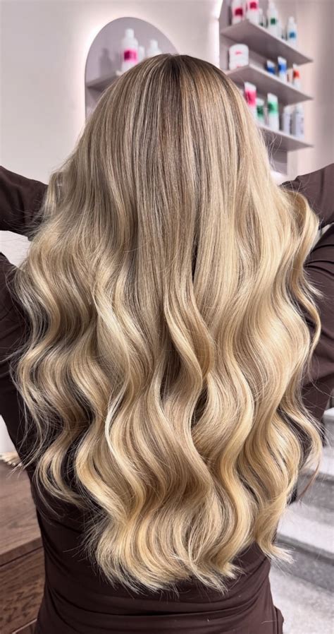 Creamy Rooted Butter Blonde Long Hairstyle With Cascading Waves