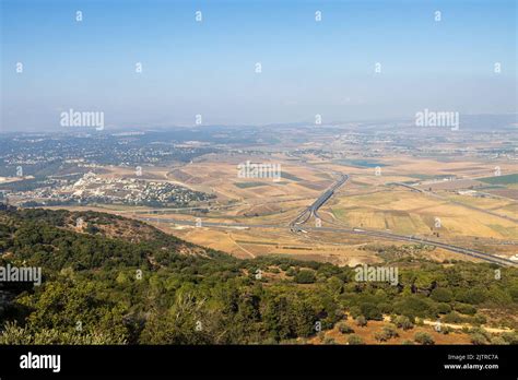 View Of The Jezreel Valley In Fog In Winter Cloudy Day From Muhraqa On