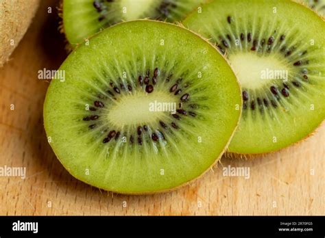 A Group Of Cut Green Kiwi Fruits With Black Seeds Details Of Green
