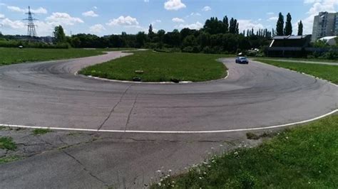 Blue Sports Car Turns On A Track Outside Stock Video Pond