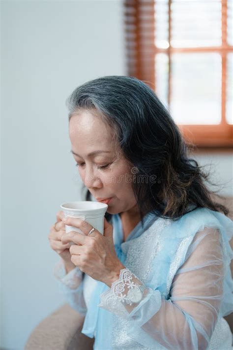 Portrait Of An Elderly Asian Woman Drinking Tea For Health Stock Image Image Of Grandmother