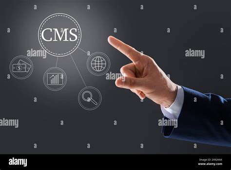 Cms Man Using Virtual Screen Closeup Scheme With Icons On Dark