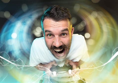 Premium Photo Enthusiastic Gamer Joyful Young Man Holding A Video Game Controller