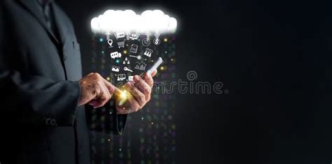 Cloud Computing Concept A Man Uses A Smartphone To Upload And Download It Resources Via Cloud